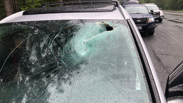 Falling rock crashes through windshield, nearly hits driver in head