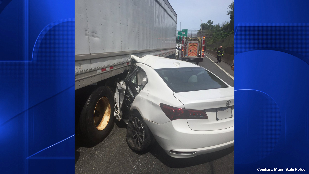 Driver suffers only minor injuries after pinning car under truck ...