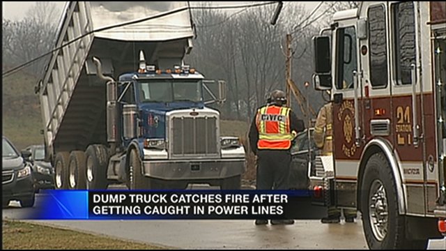Dump truck driver rescued after vehicle gets stuck in power lines