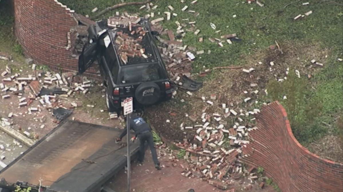 Car crashes into, destroys part of brick wall in Cambridge