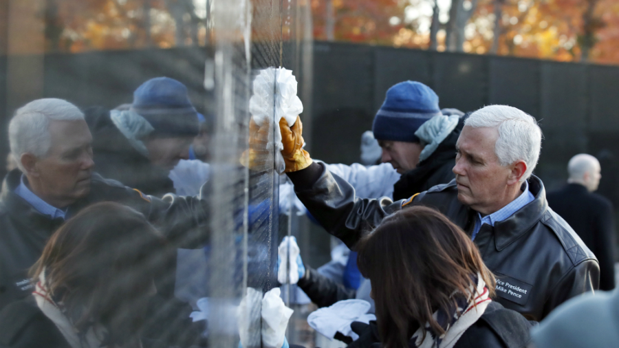 Vice President Pence honors veterans by washing Vietnam memorial